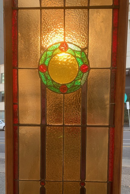 Detail of pair of stunning arched leadlight panels in timber frames ...